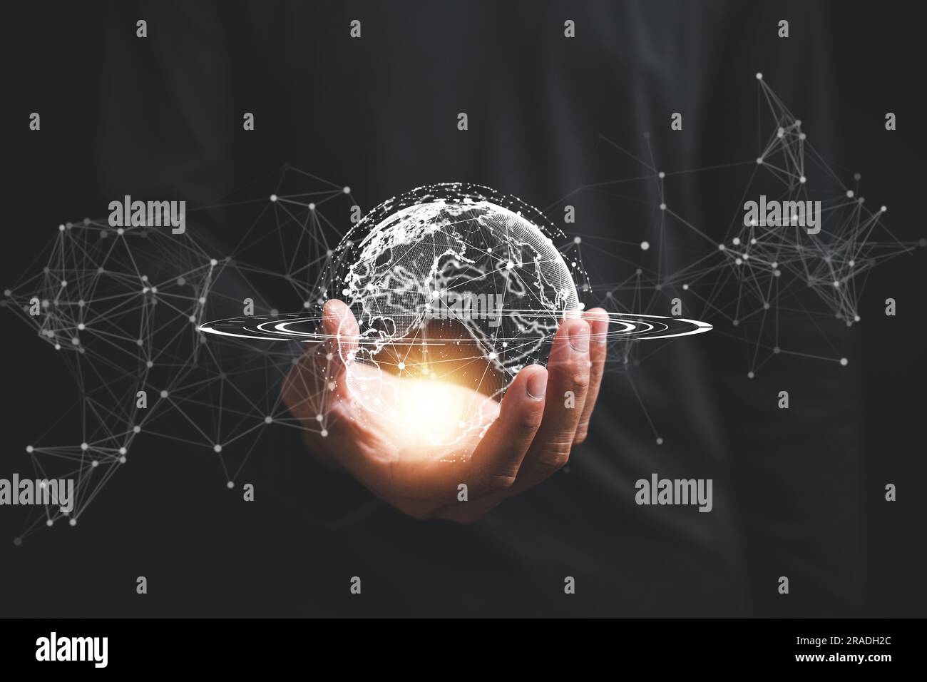 A businessman's hand holds a globe, illustrating seamless connectivity ...