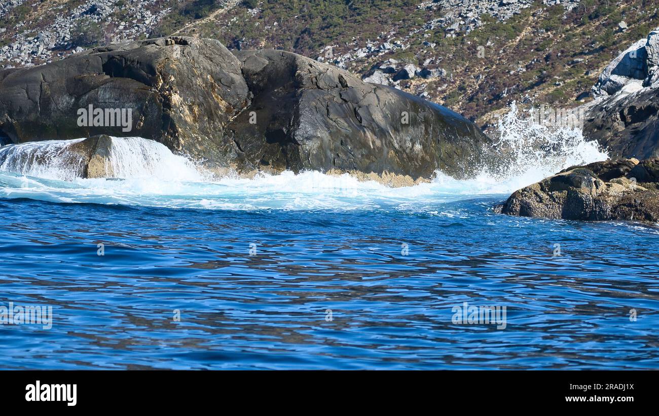 norway on the fjord, spray on rocks. Water splashes on the stones ...