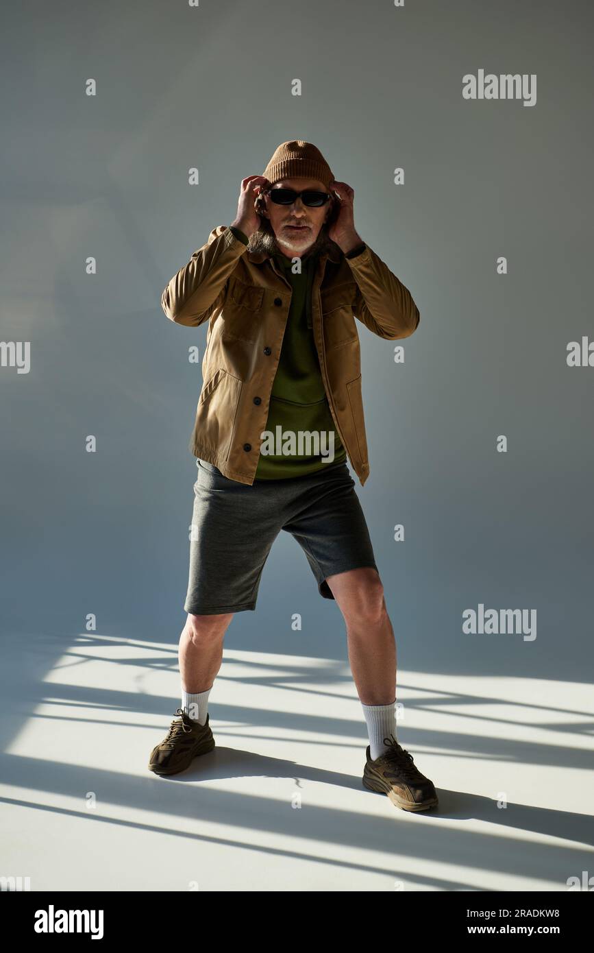 expressive personality, hipster fashion, full length of elderly man in ...