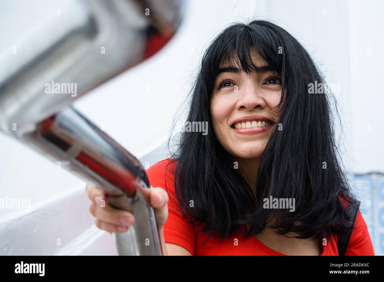 closeup of beautiful latin young woman of venezuelan ethnicity, in red ...