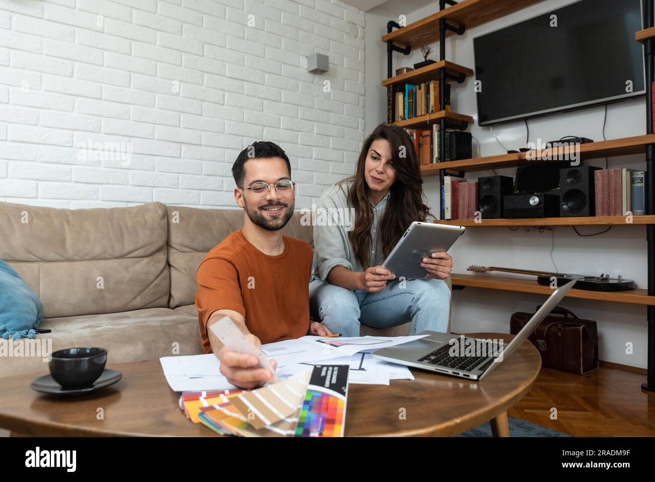 Young smart couple business owners and partners architectural exterior ...