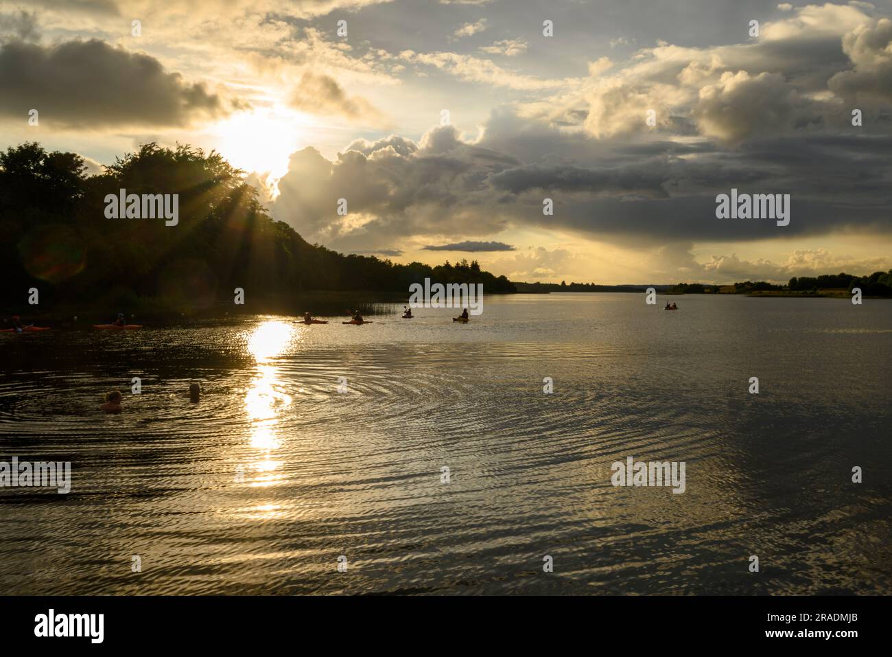 Summer evening with kayakers and cold water swimmers, Erritt Lough ...