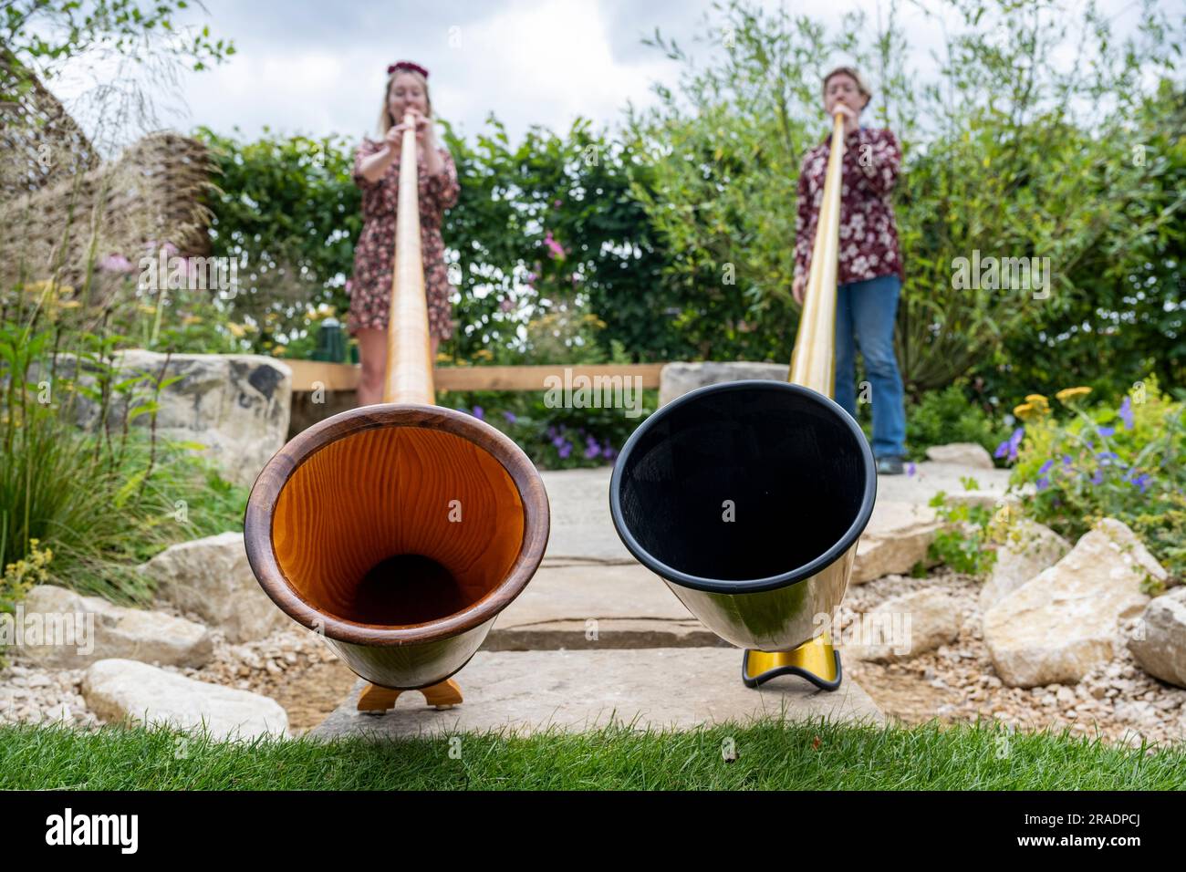 London, UK. 3 July 2023. Musicians play Swiss alphorns, an instrument ...