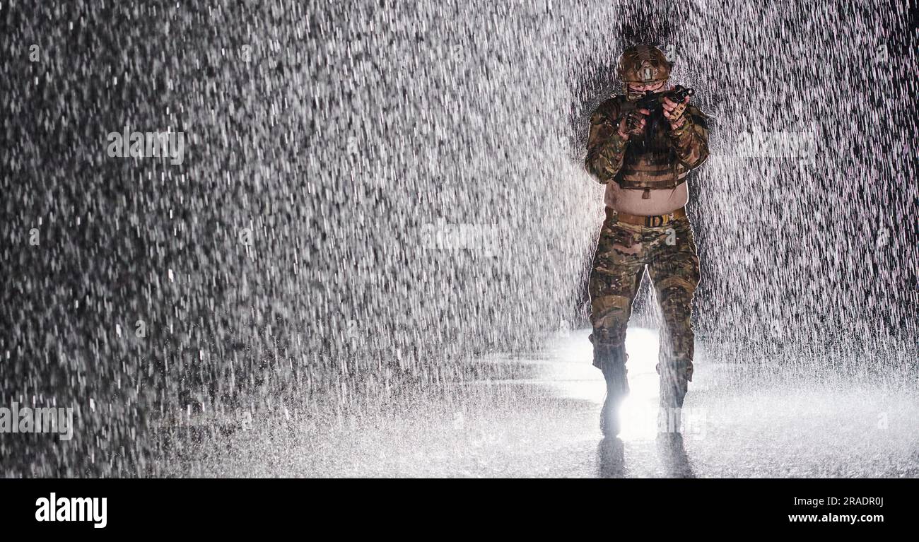 Army soldier in Combat Uniforms with an assault rifle, plate carrier ...