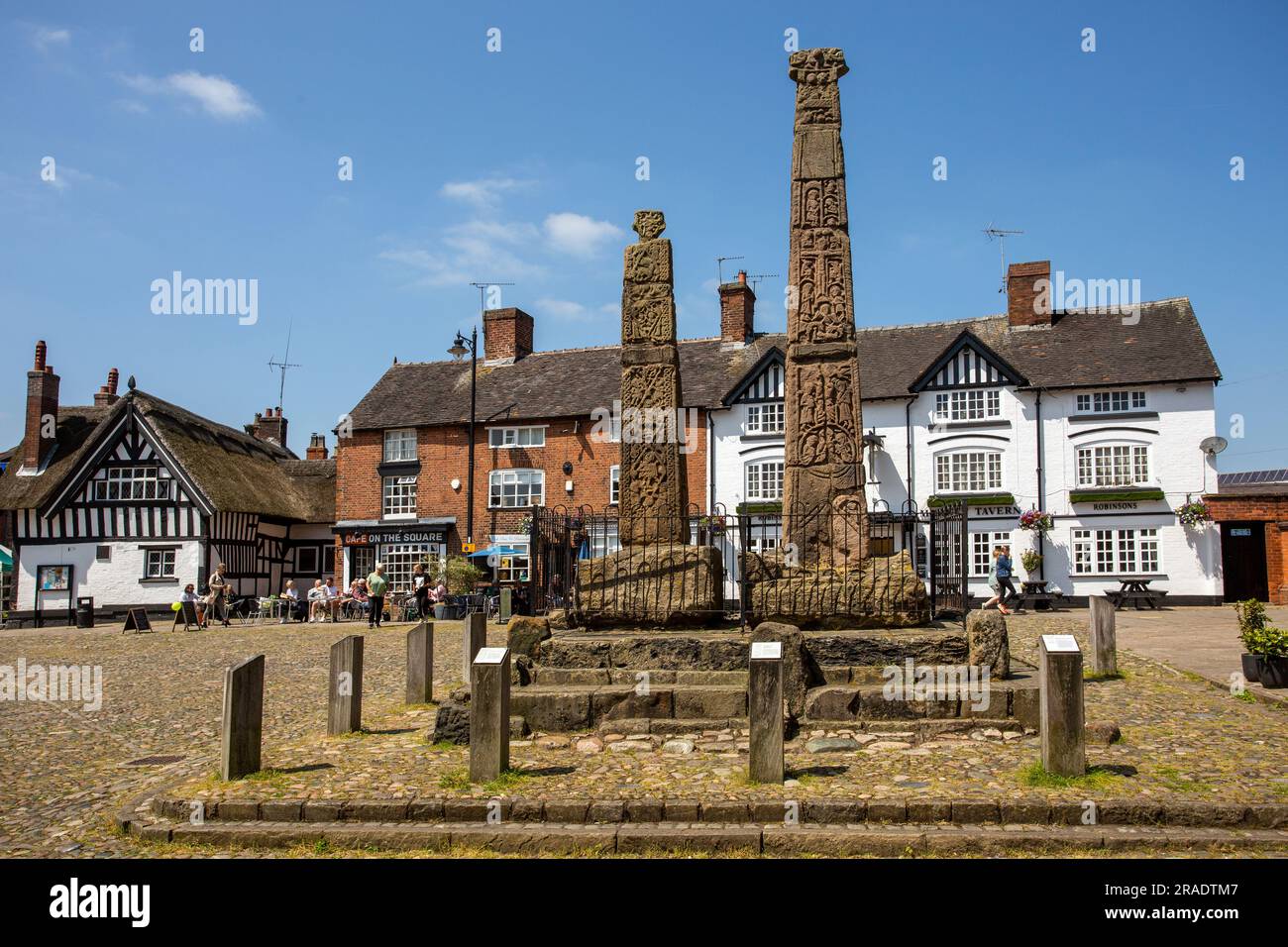 The ancient Saxon crosses in the cobbled market square of the Cheshire ...