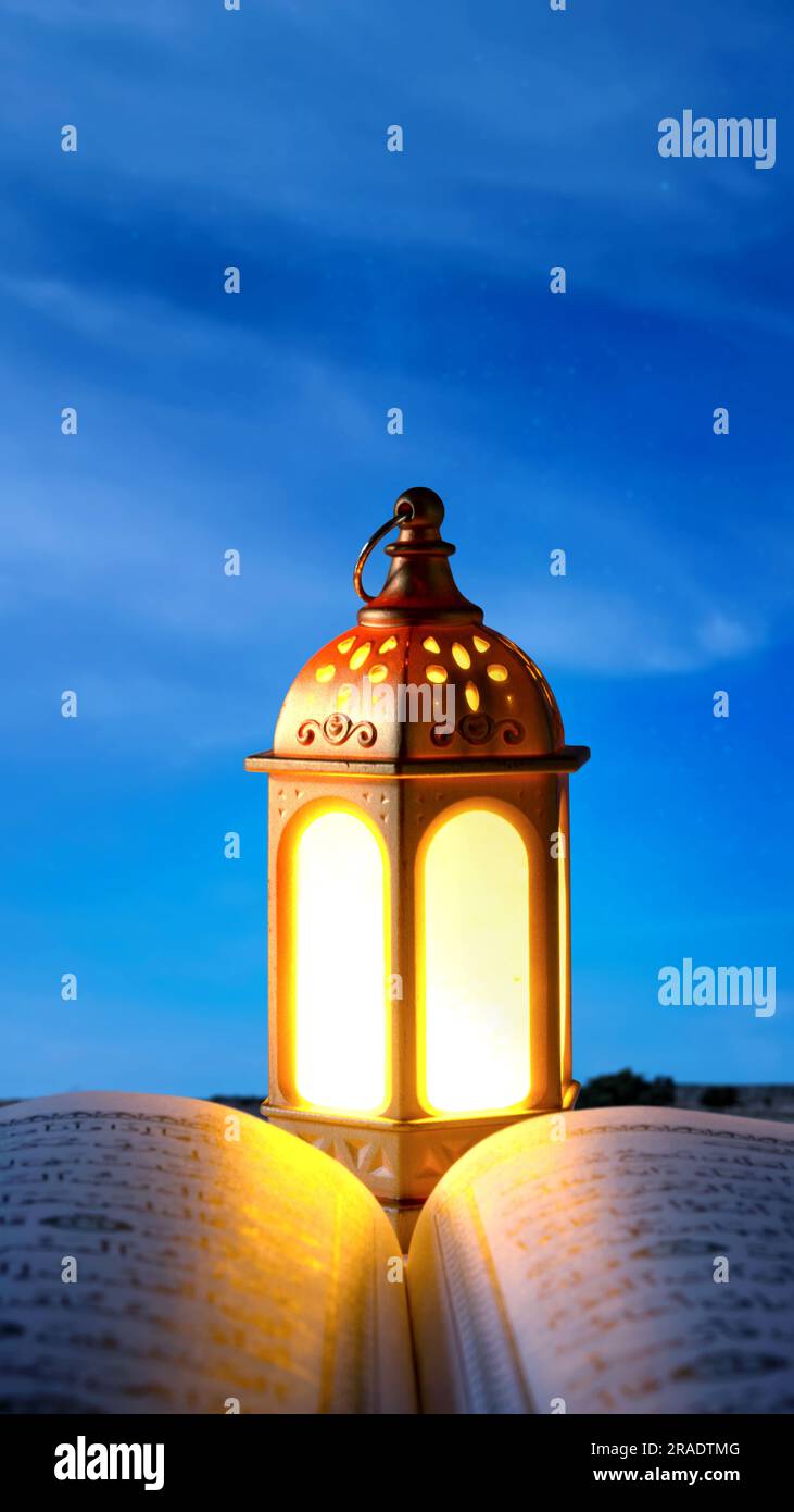 Quran and Arabic lamp with bright light with the night scene background ...