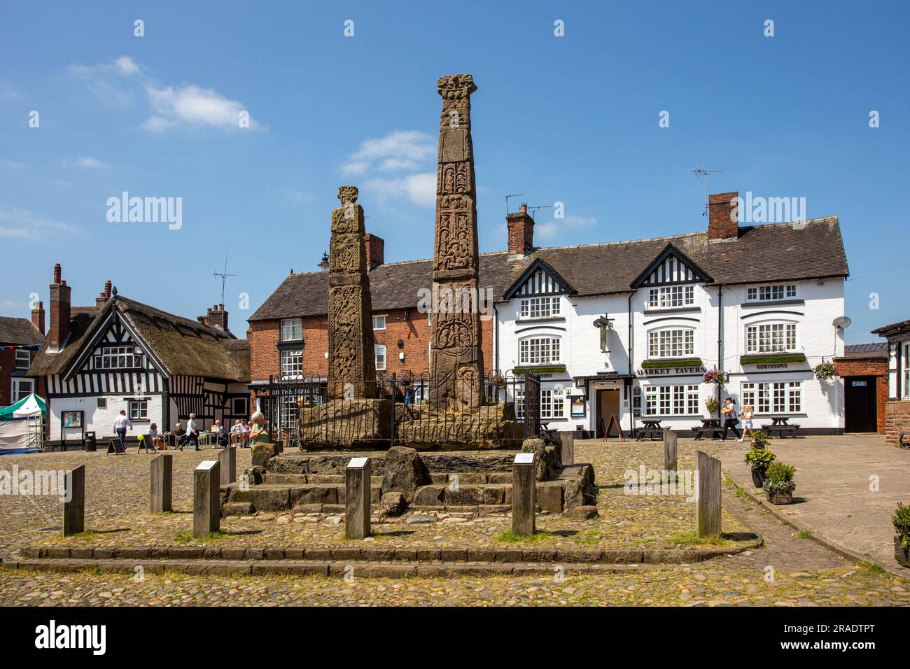 The ancient Saxon crosses in the cobbled market square of the Cheshire ...