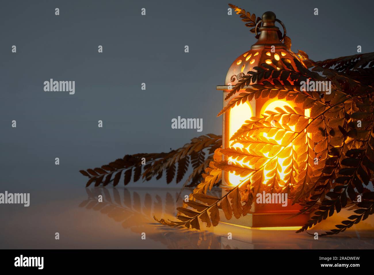 Arabic lamp with bright light with dark background Stock Photo - Alamy