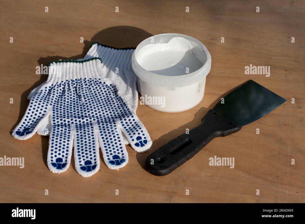 Builders kit, construction spatula, can of white putty, protective ...