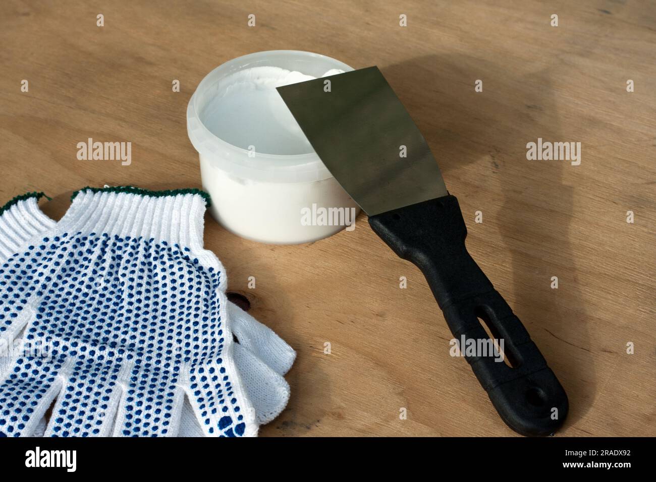 Builders kit, construction spatula, can of white putty, protective ...