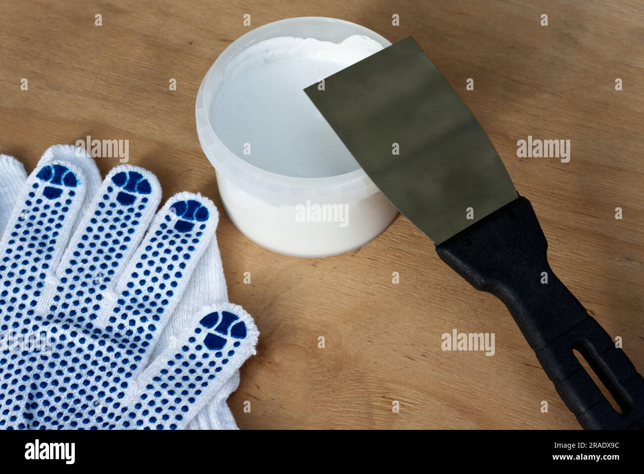 Builders kit, construction spatula, can of white putty, protective ...