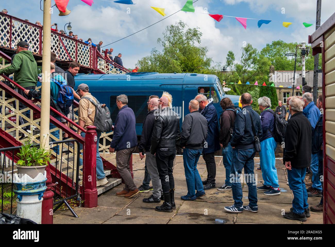 Vintage diesel rail enthusiasts queueing for their train at Ramsbottom ...