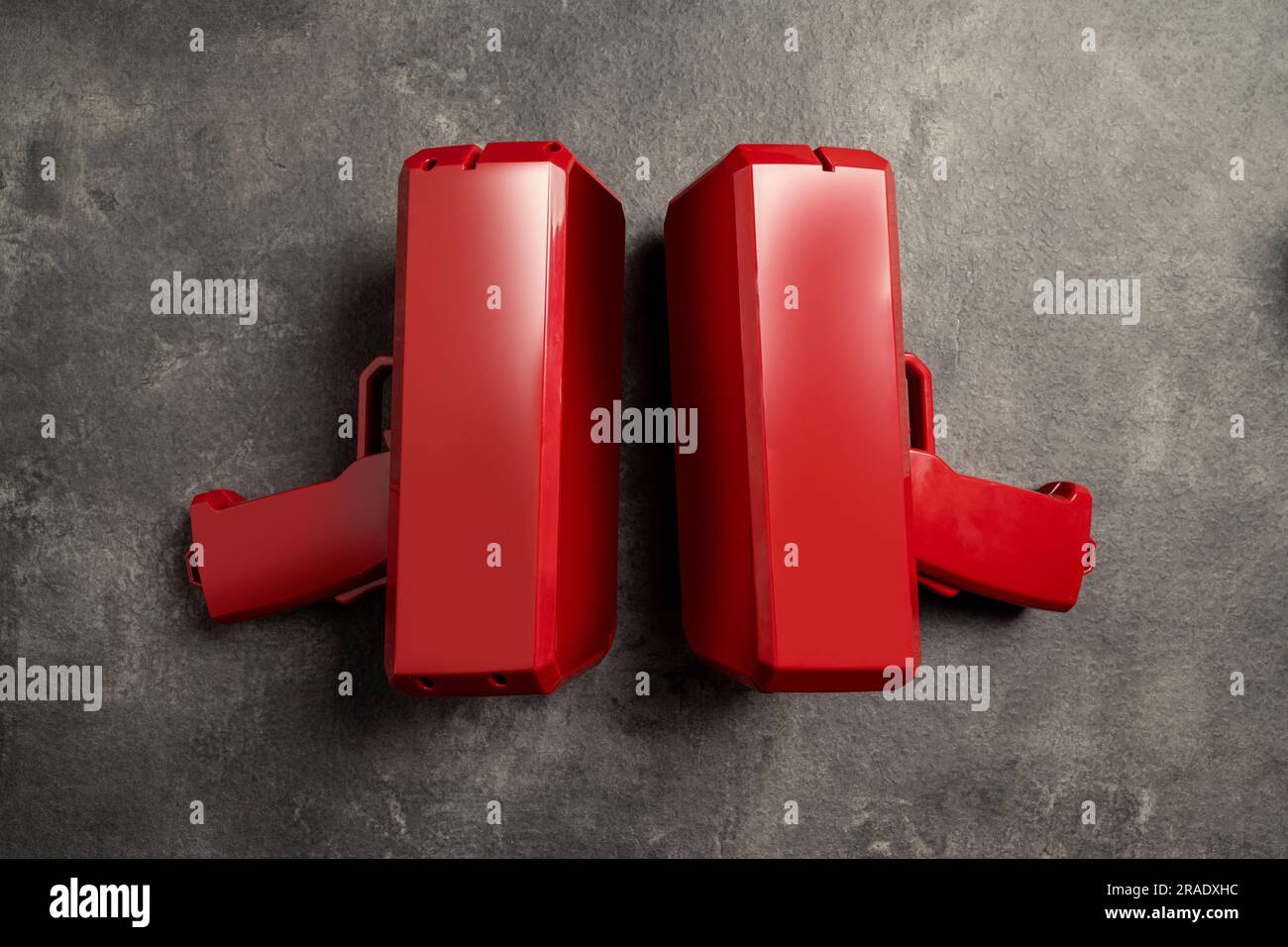 Red money gun on black background Stock Photo - Alamy