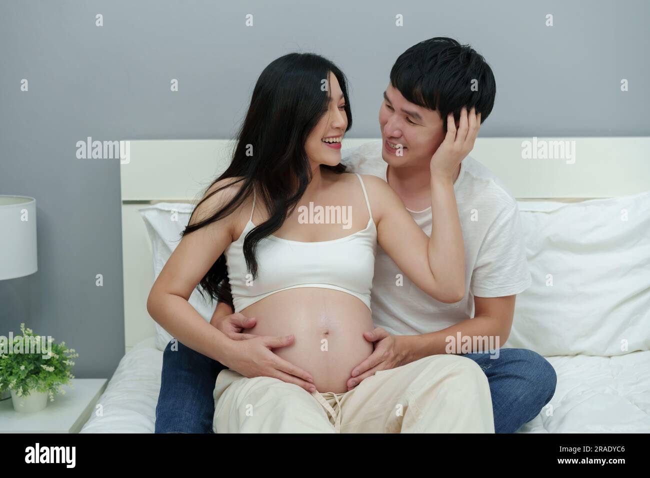 Asian woman embraces father hi-res stock photography and images - Alamy