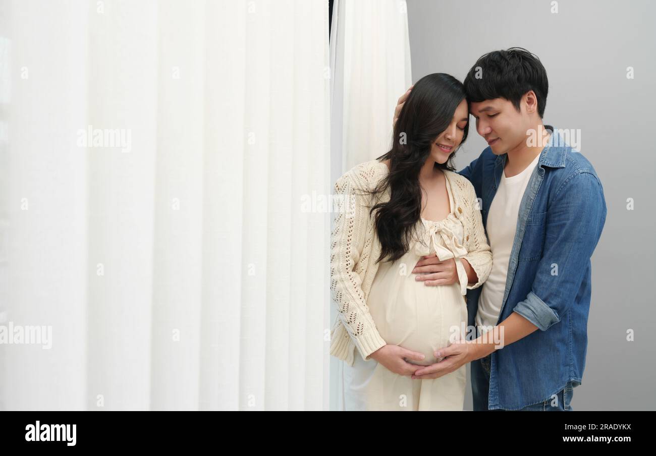 Asian woman embraces father hi-res stock photography and images - Alamy