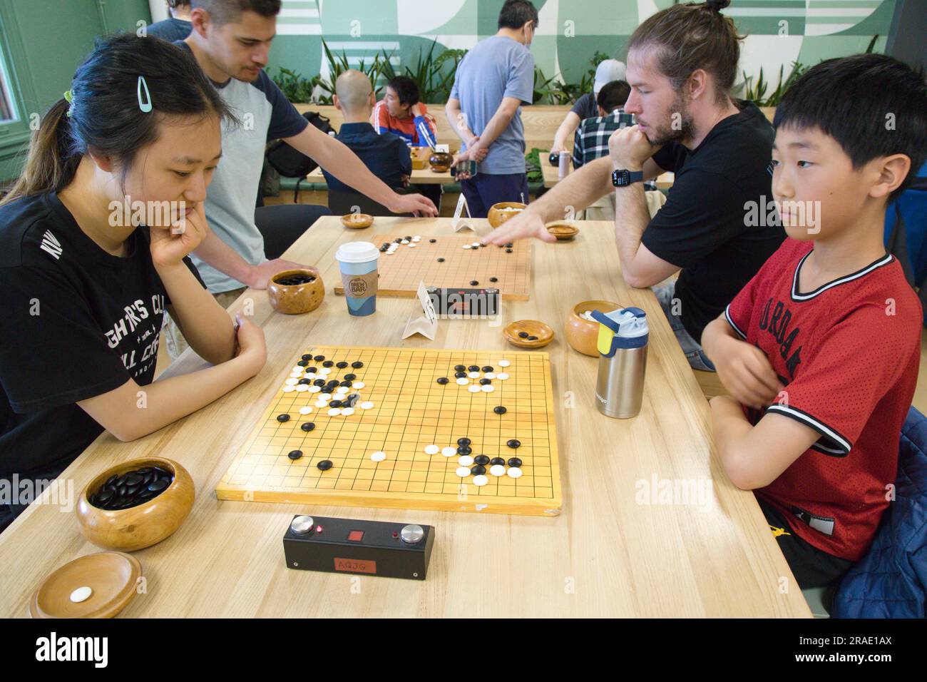 Go players, strategic board game Stock Photo - Alamy