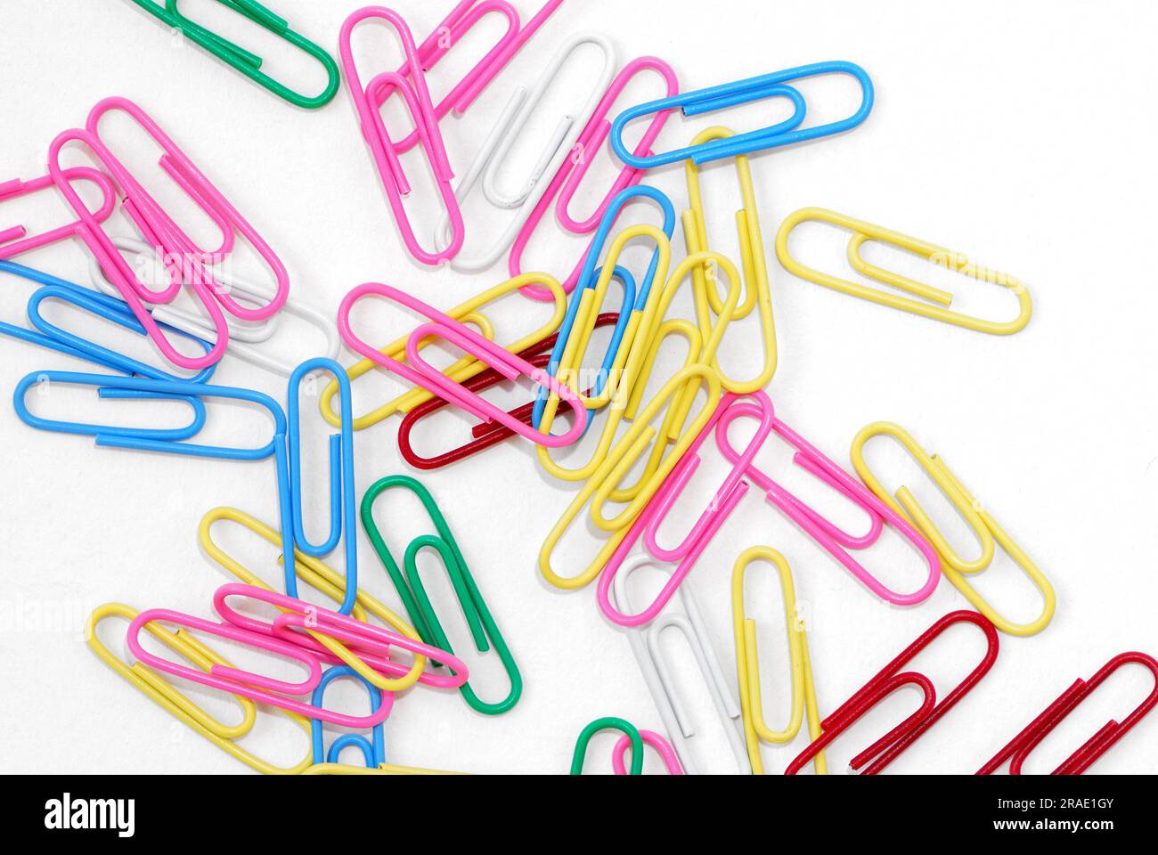 Colourful paper-clips on a white paper Stock Photo - Alamy