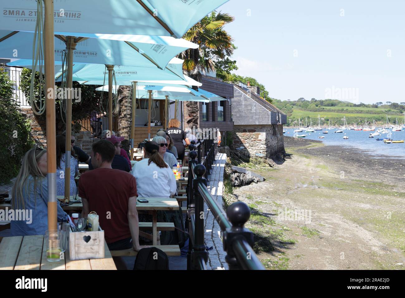 Visitors to Helford enjoying an afternoon drink and beautiful views at ...