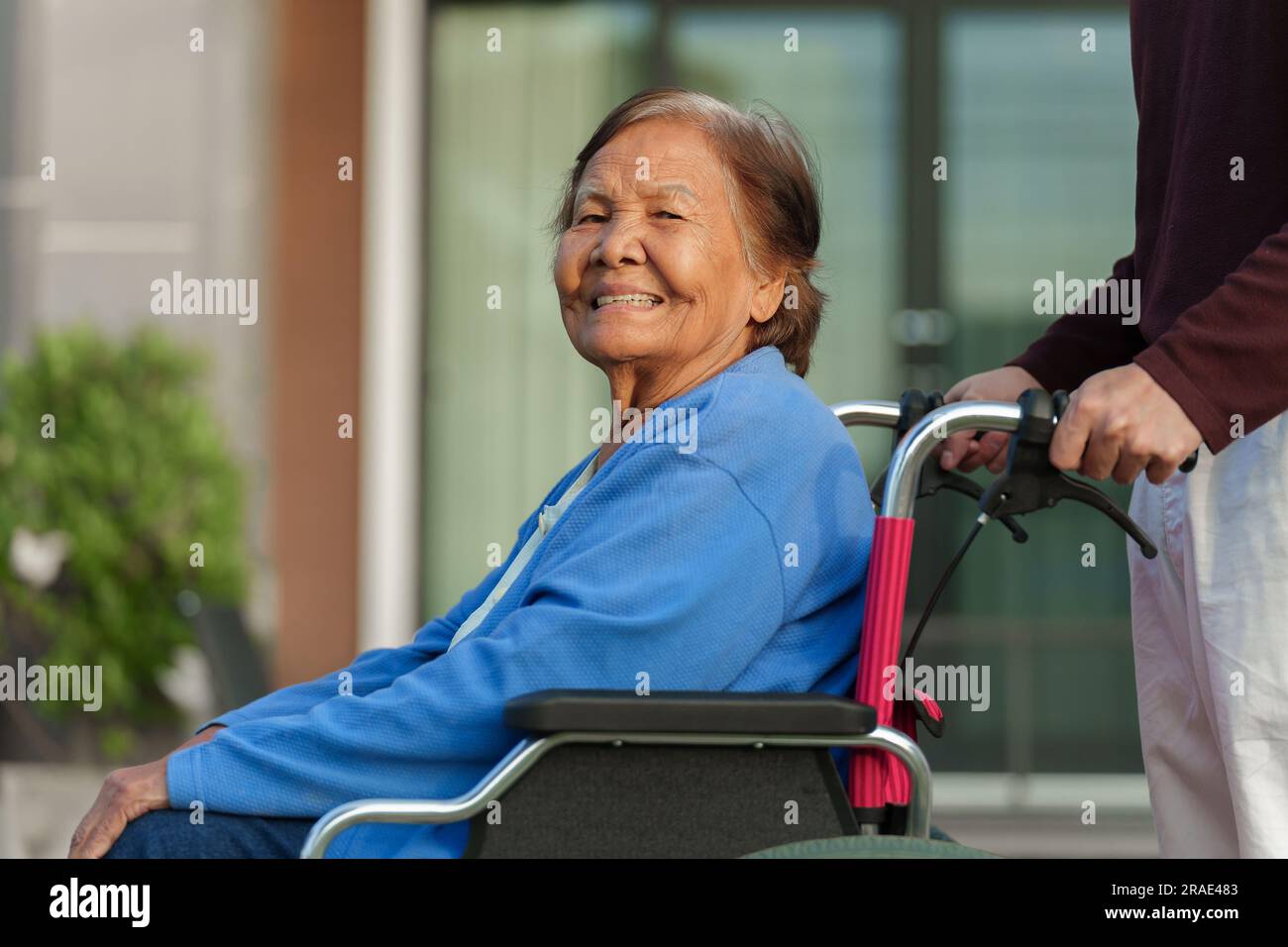 Man pushing old woman in hi-res stock photography and images - Alamy