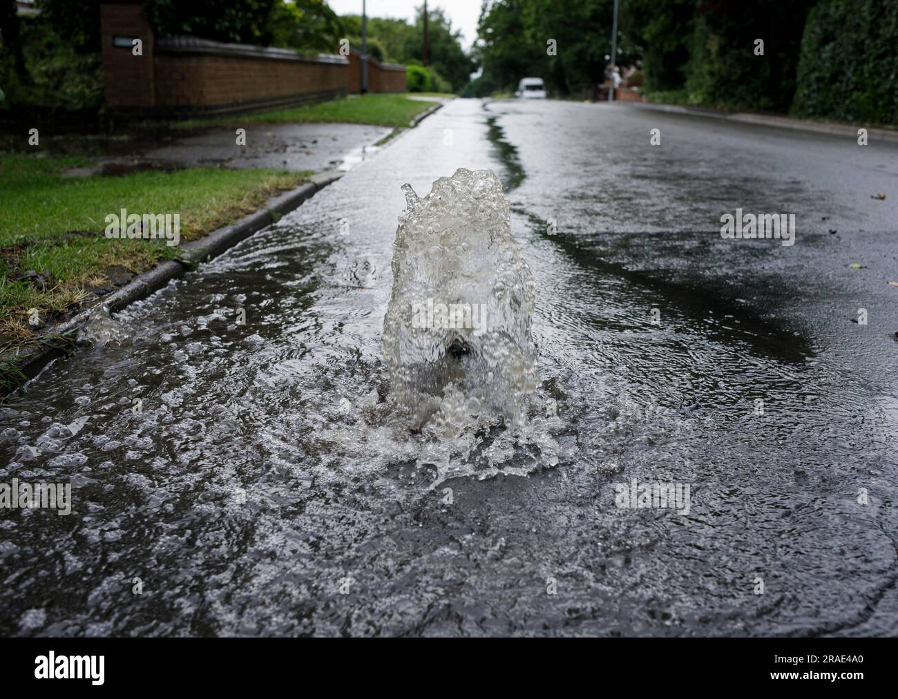 Rain water forcing its way up through a drain after a storm in Redditch ...