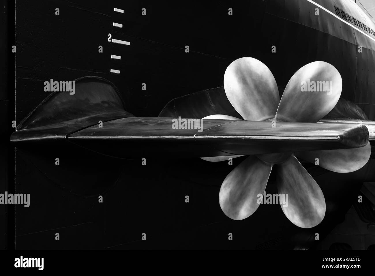 Huge shiny submarine propeller, close up black and white industrial ...