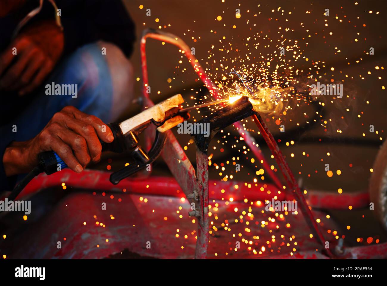 welder working with welding on metal frame with sparking light Stock ...
