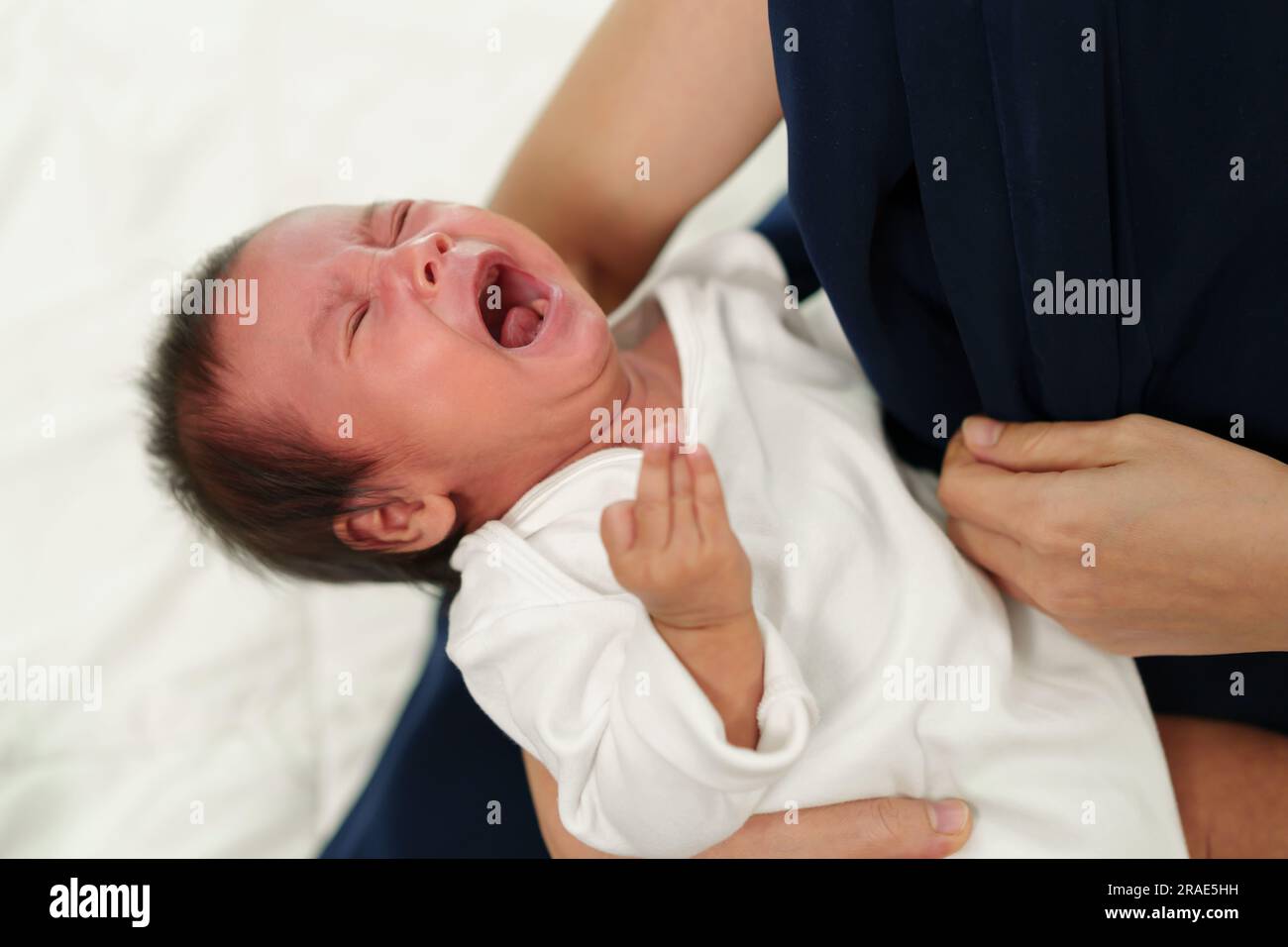 Unhappy chinese woman with newborn hi-res stock photography and images - Alamy