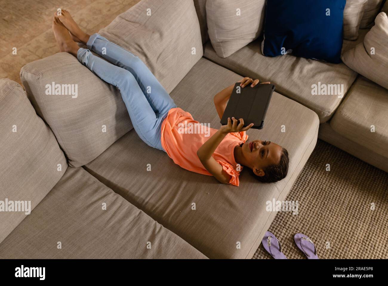 Little girl feet up hi-res stock photography and images - Alamy