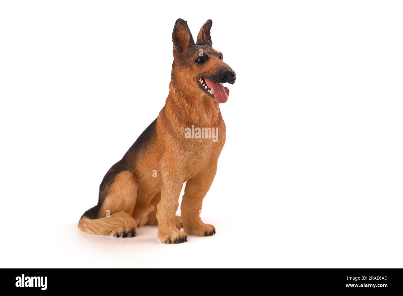dog figurine toy German Shepherd made of wood, isolated on white Stock ...