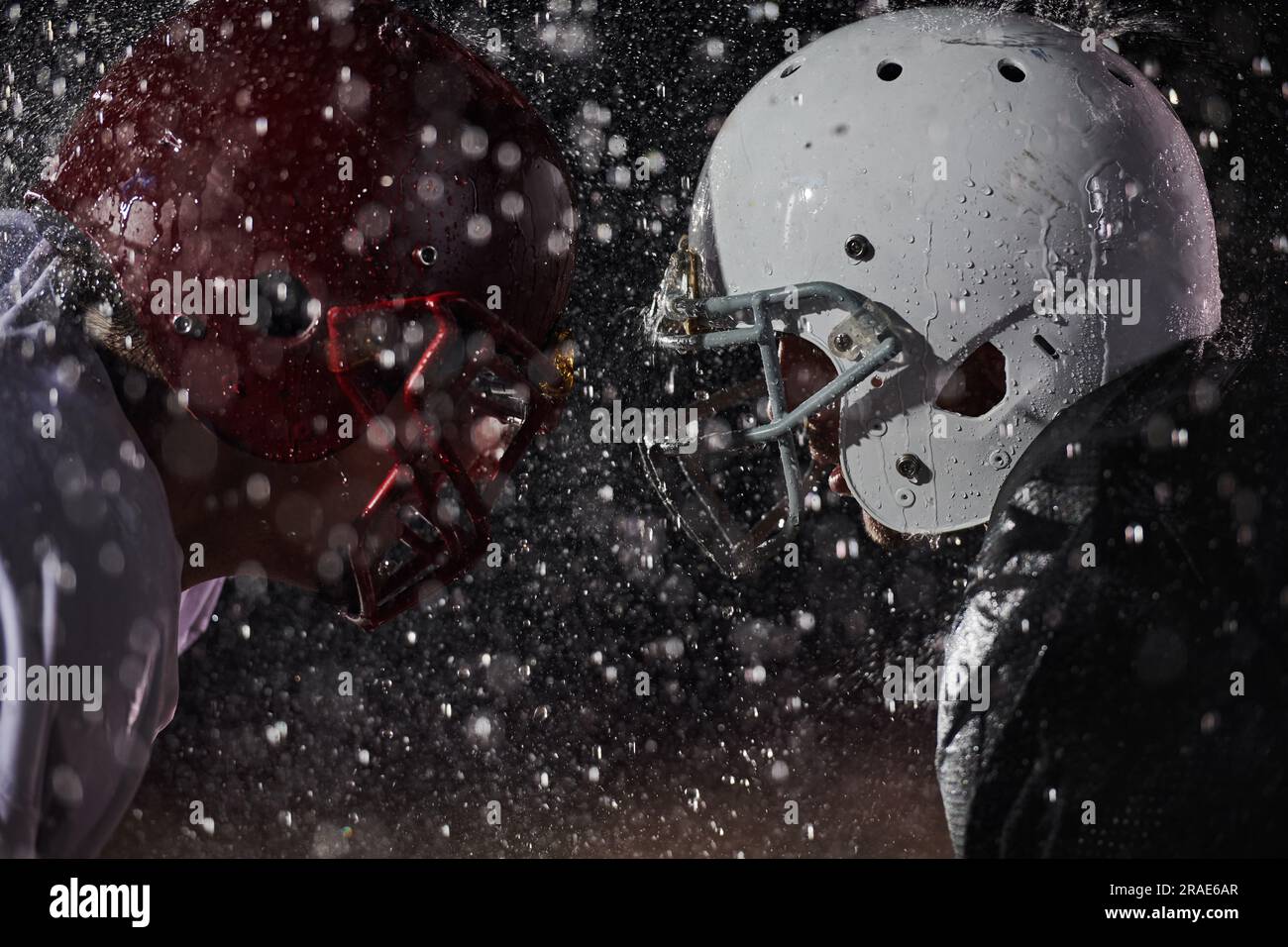 Two american football players face to face in silhouette shadow on ...