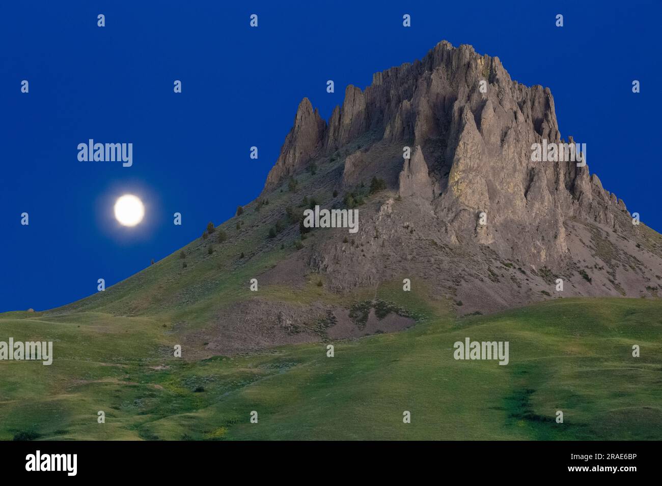full moon rising behind birdtail butte near simms, montana Stock Photo ...