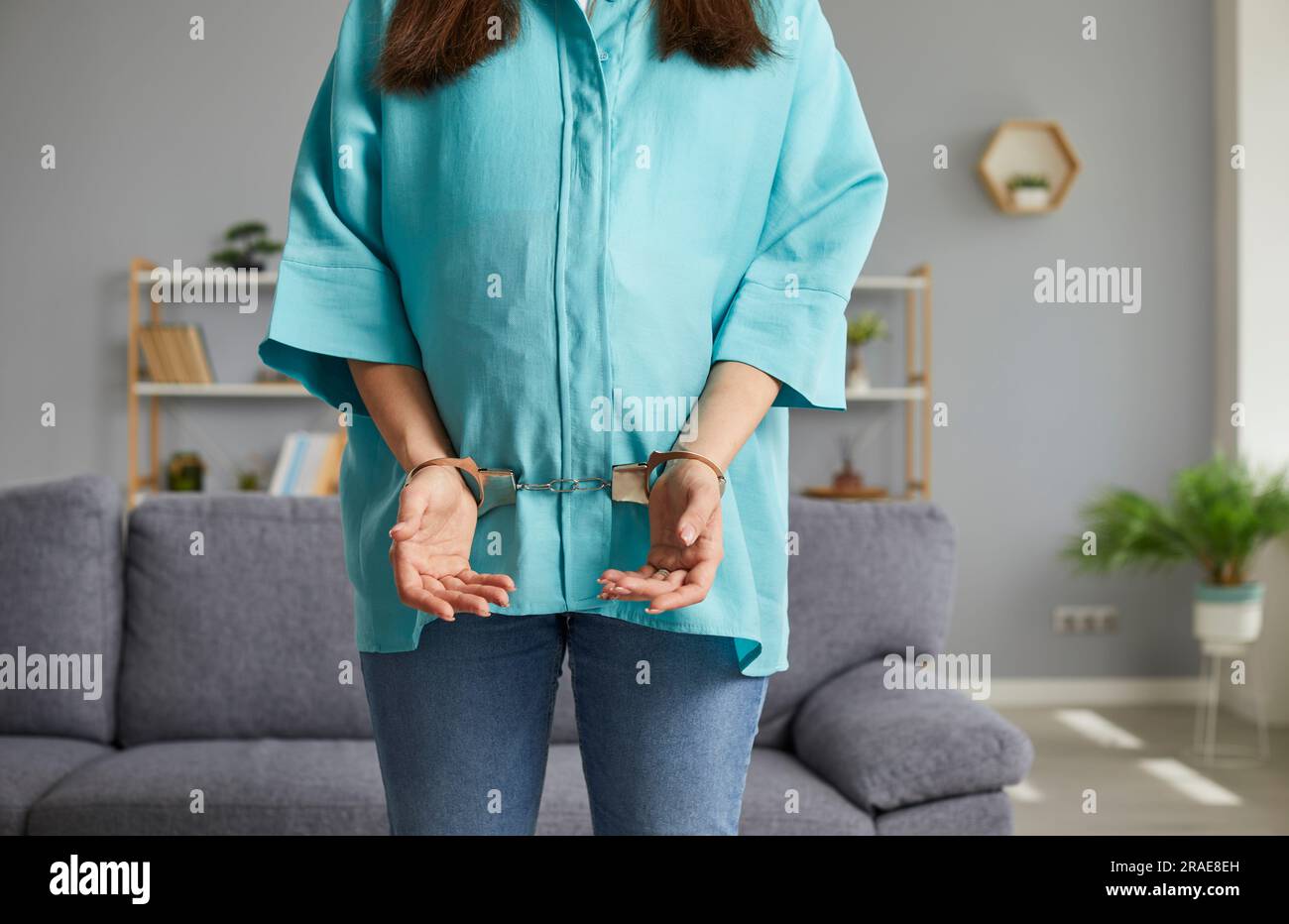 Pregnant woman wearing handcuffs because of arrest or as symbol for ...