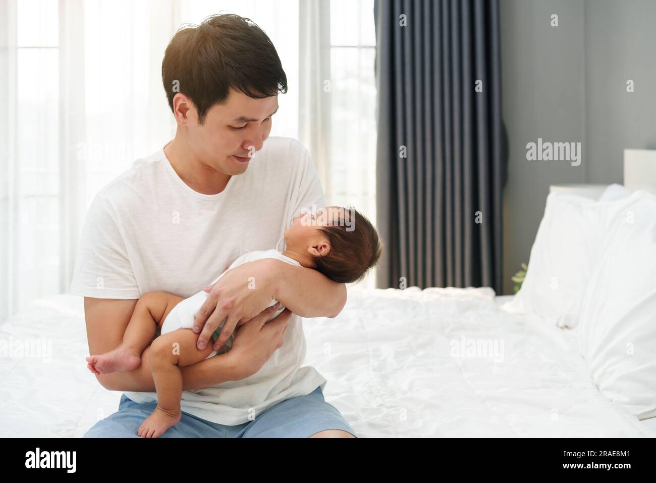 Father son talking bed hi-res stock photography and images - Alamy