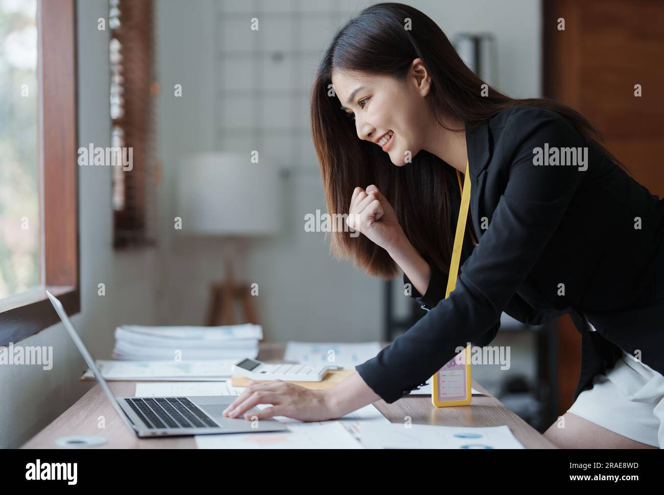 Portrait of a woman business owner showing a happy smiling face as he ...