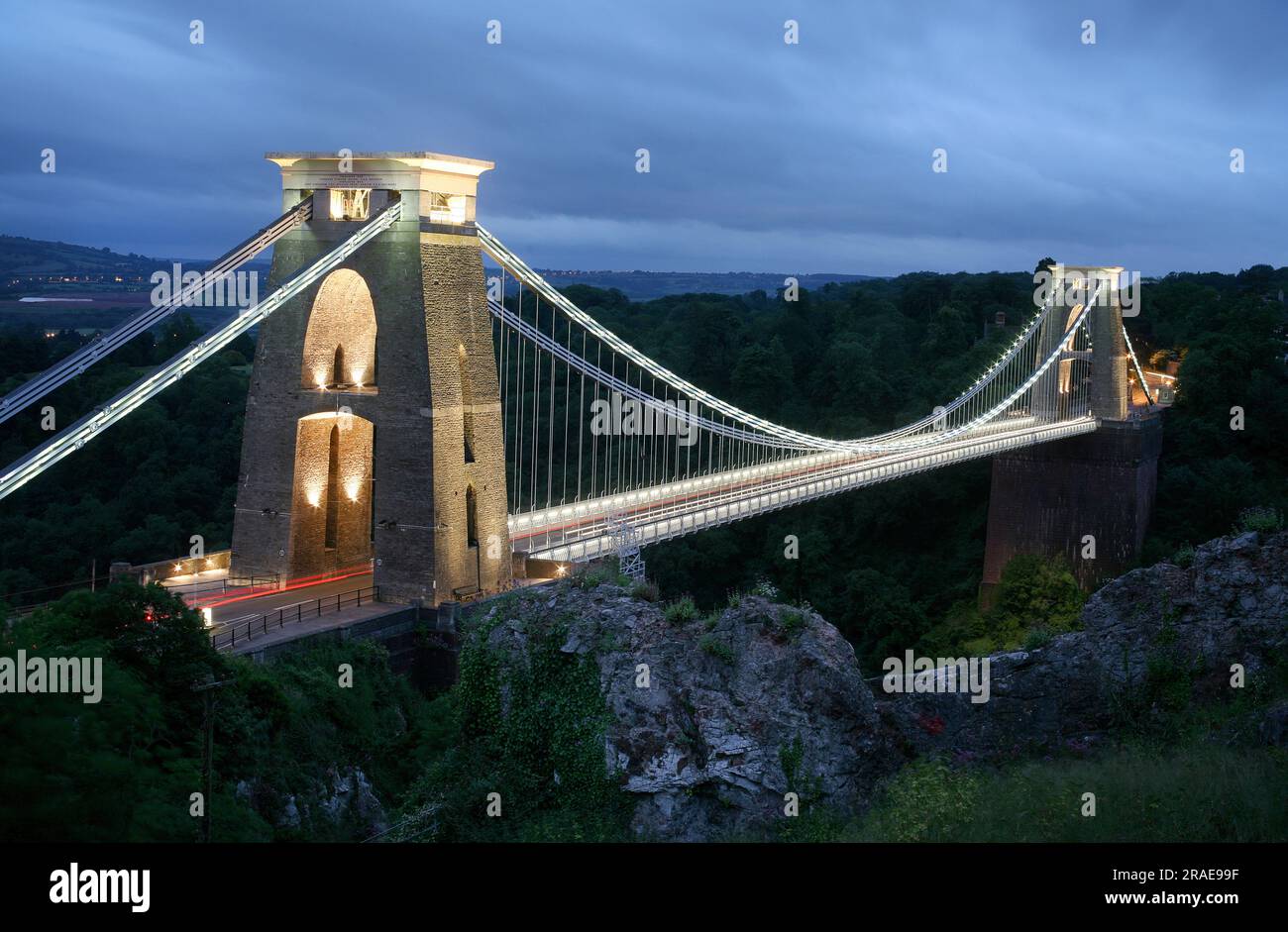 Cars cross Brunel's Clifton suspension bridge in Bristol at dusk Stock ...