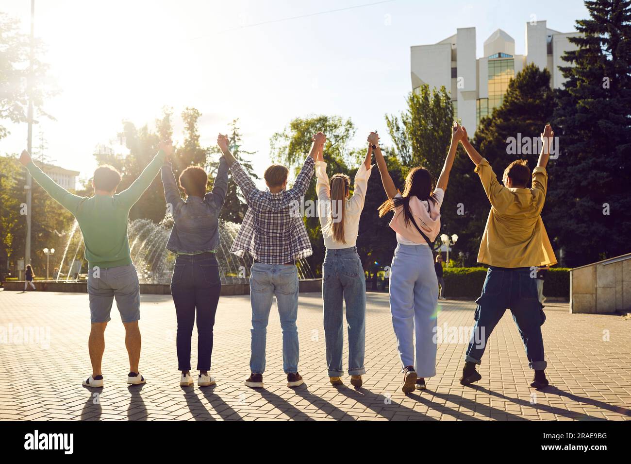 Woman walking arms raised hi-res stock photography and images - Alamy