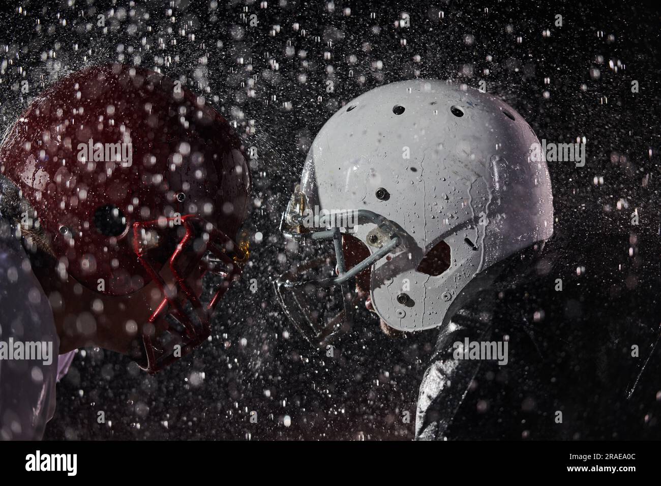 Two american football players face to face in silhouette shadow on ...