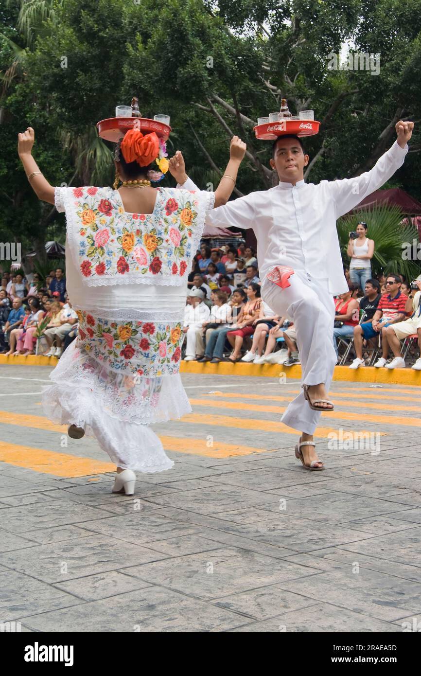 Dancers in traditional traditional costume, folk dance, balancing trays ...
