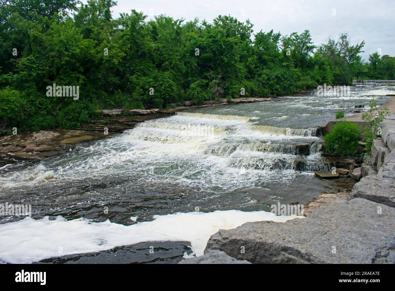 Series of small waterfalls flowing down the Napanee River in Ontario ...