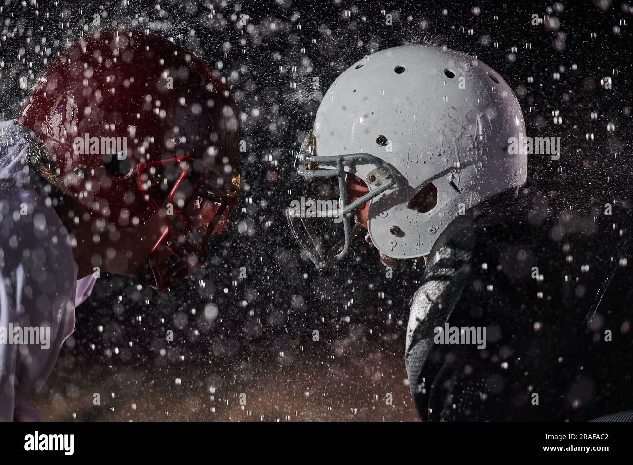 Two american football players face to face in silhouette shadow on ...