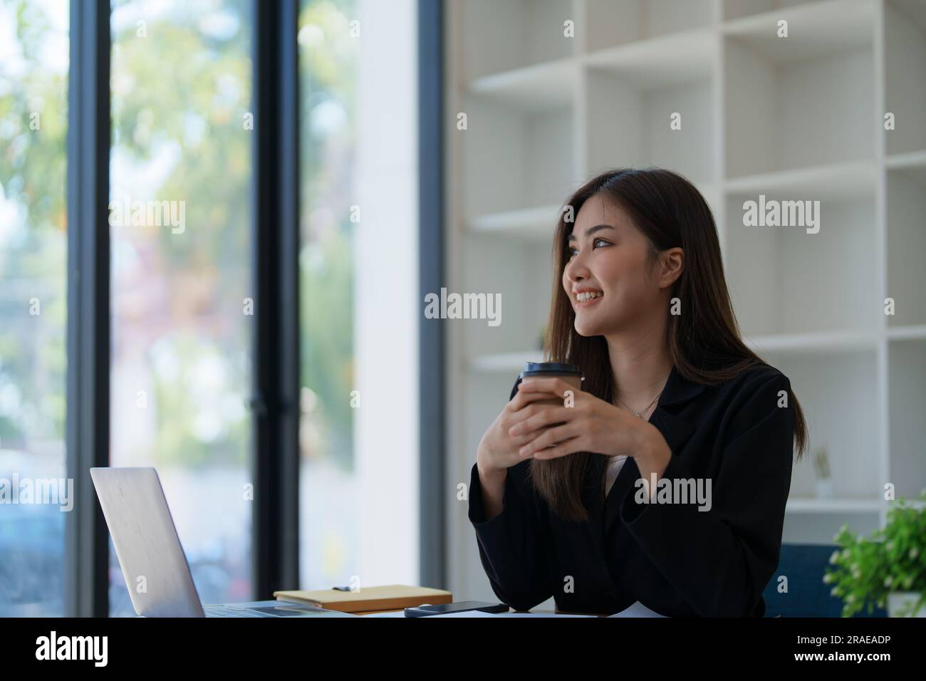 Portrait of a woman business owner showing a happy smiling face as he ...