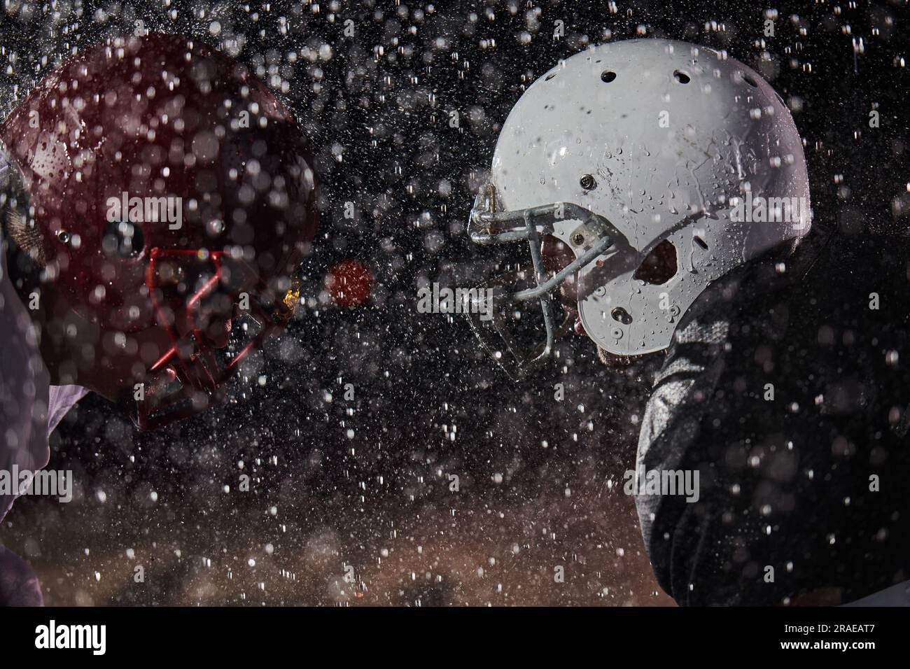 Two american football players face to face in silhouette shadow on ...