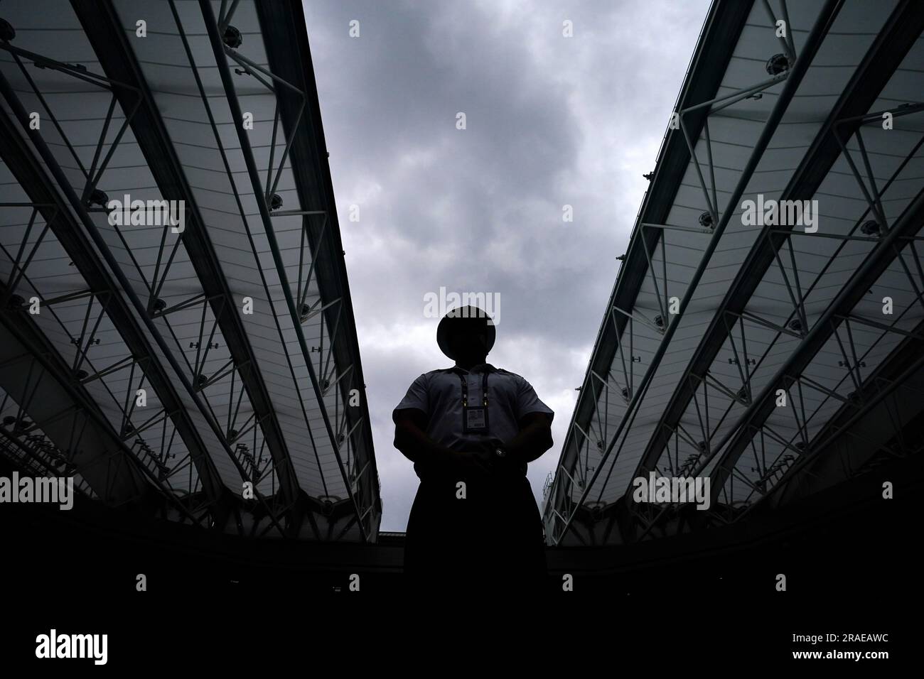 A member of the armed forces on centre court as the roof is closed on ...