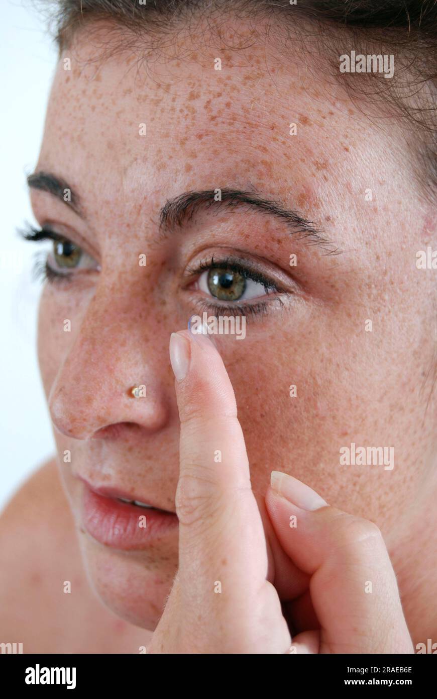 Young woman insert contact lens, contact, insertion Stock Photo - Alamy