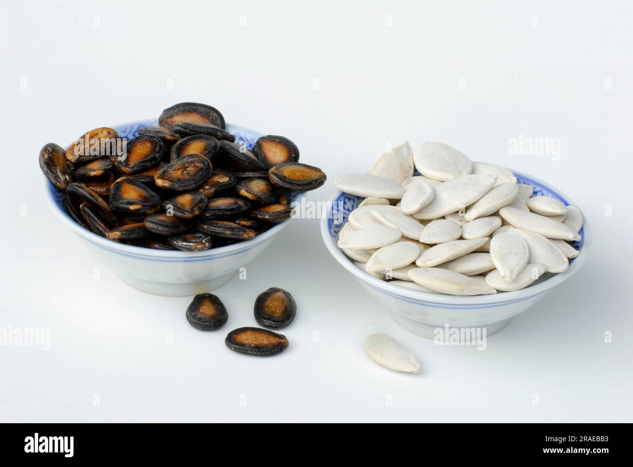 Black and white melon seeds, in shell, melon seeds Stock Photo - Alamy