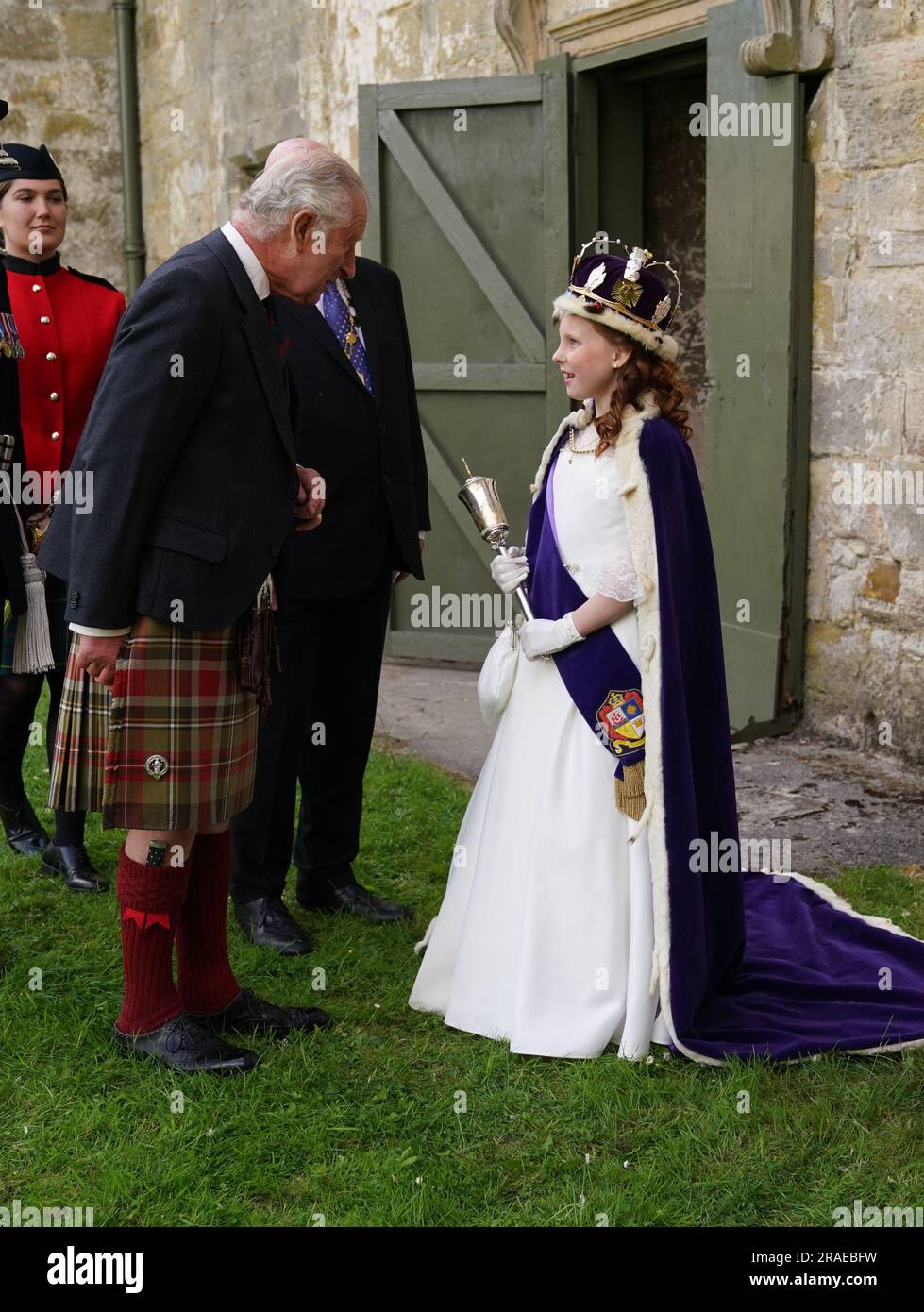 King Charles III greets the Bo'ness Fair Queen, Lexi Scotland, during ...