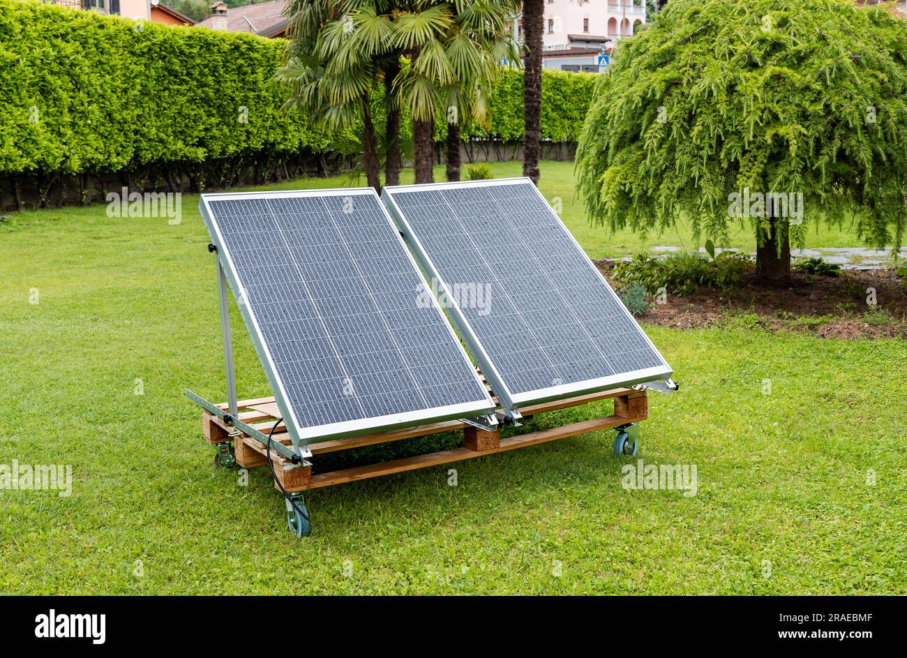 Photovoltaic panels wet from the rain on the wooden pallet in the home ...