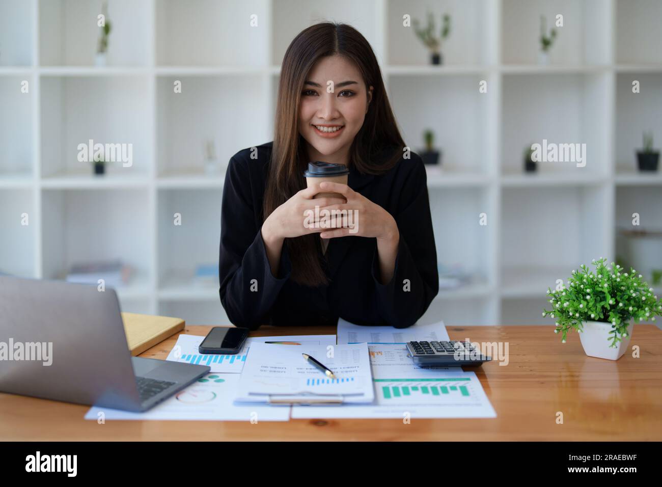 Portrait of a woman business owner showing a happy smiling face as he ...