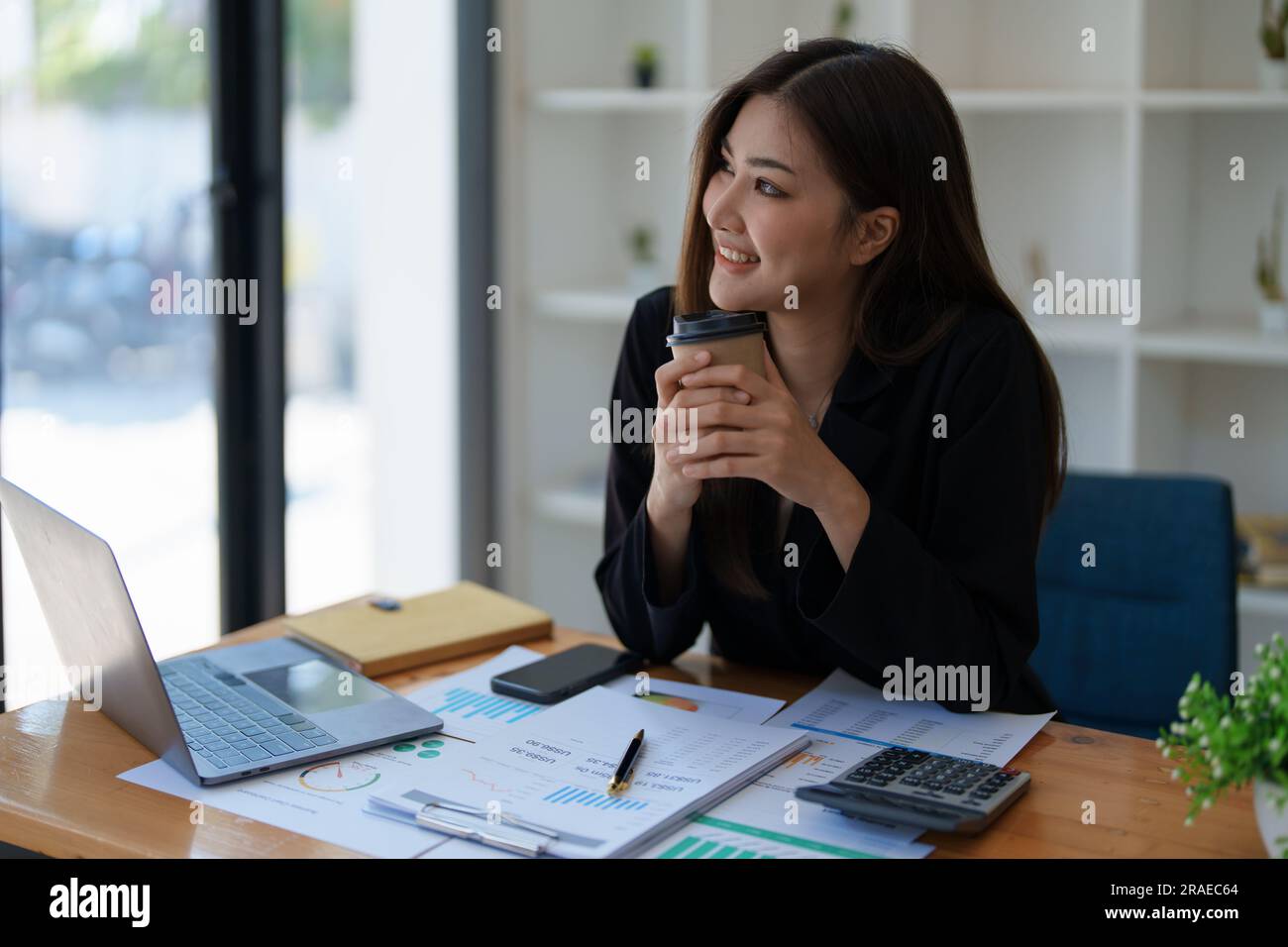 Portrait of a woman business owner showing a happy smiling face as he ...