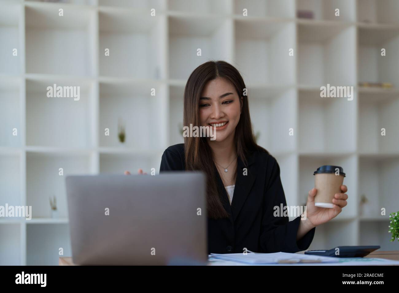 Portrait of a woman business owner showing a happy smiling face as he ...